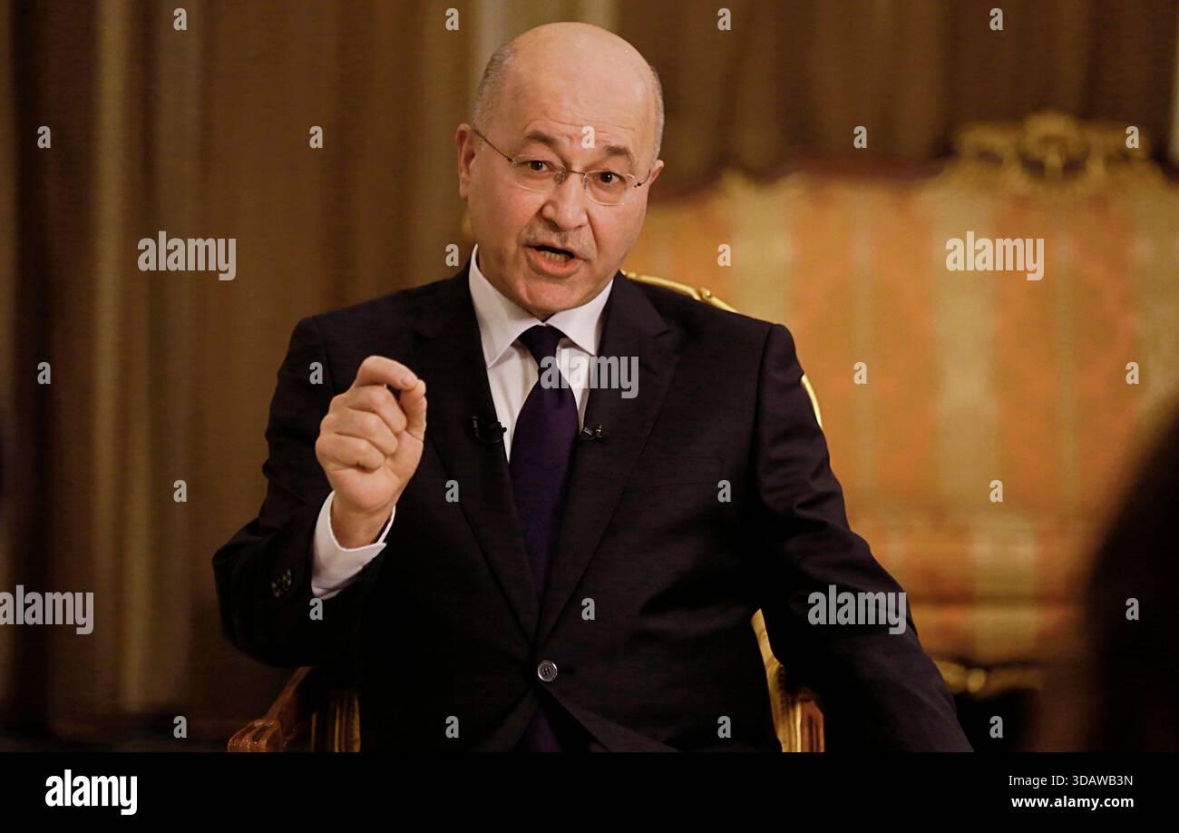 FILE - Iraq's President Barham Salih speaks during an interview with ...