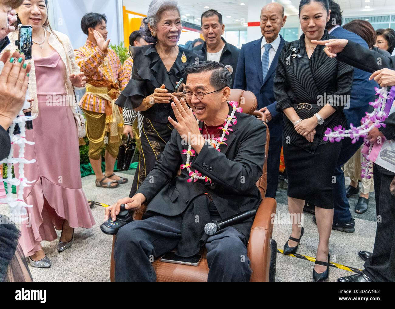 Krisana Lalai is seen greeting a participant with a ‘Sawadee' gesture ...