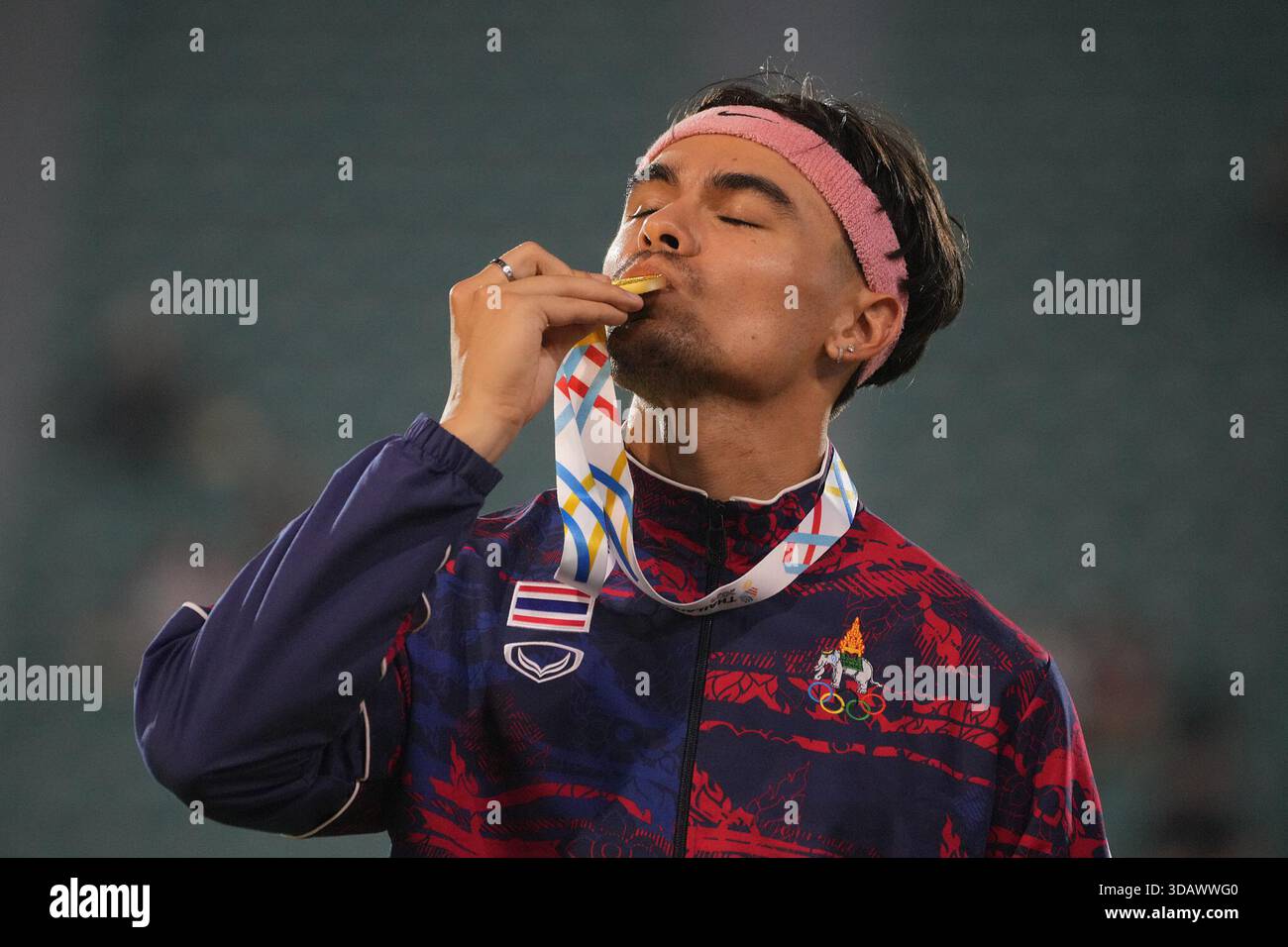 Thailand's Joshua Robert Atkinson kisses a medal during the medal ...
