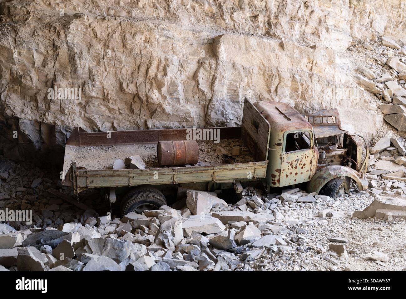 The rusty truck of the abandoned quarry of the world-famous marble of ...