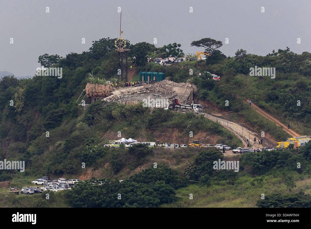 A concrete and debris following multi-story building that was under ...