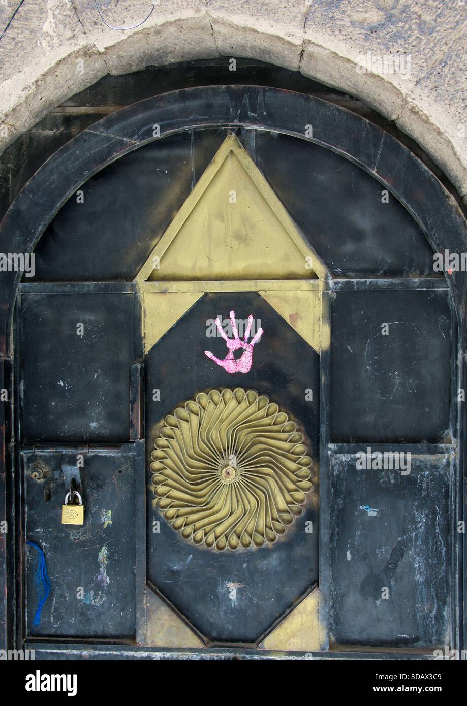 Handprint to protect from the evil eye on a door, Amanat Al-Asemah ...