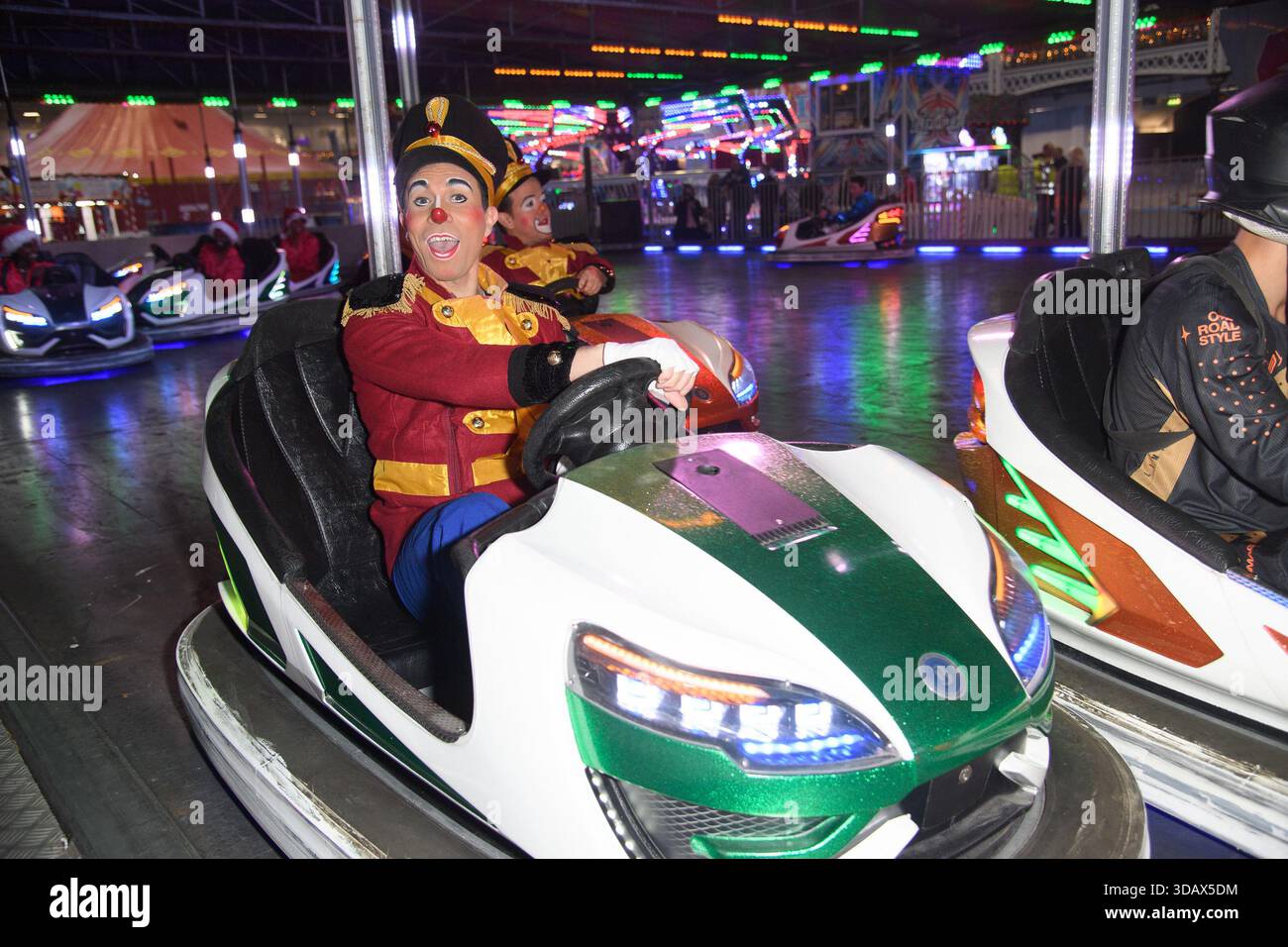 London, UK. 12 Dec 2025. Performers on dodgem cars at The Winter ...