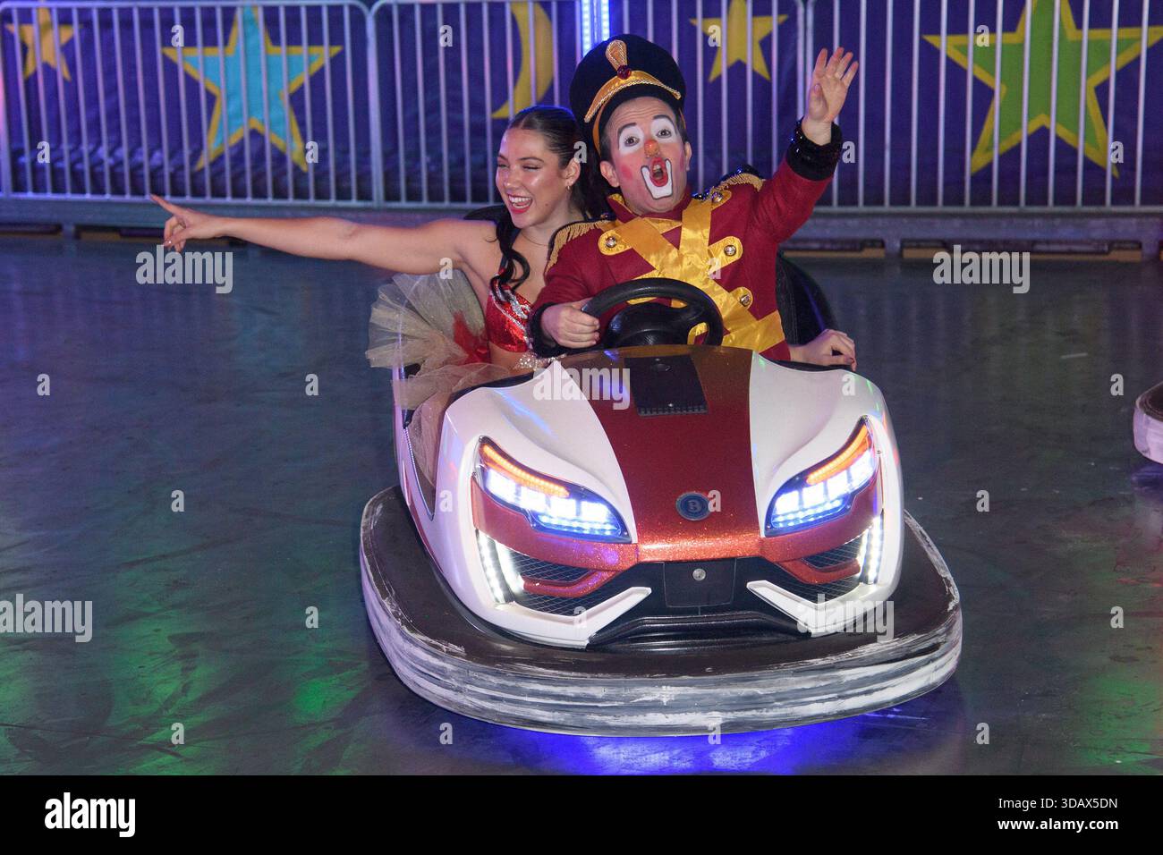 London, UK. 12 Dec 2025. Performers on dodgem cars at The Winter ...