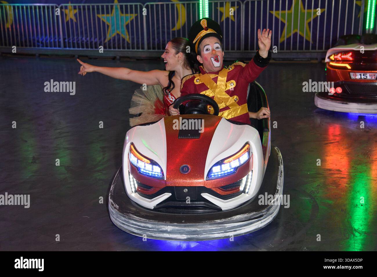 London, UK. 12 Dec 2025. Performers on dodgem cars at The Winter ...