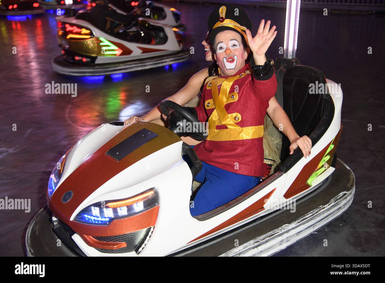 London, UK. 12 Dec 2025. Performers on dodgem cars at The Winter ...