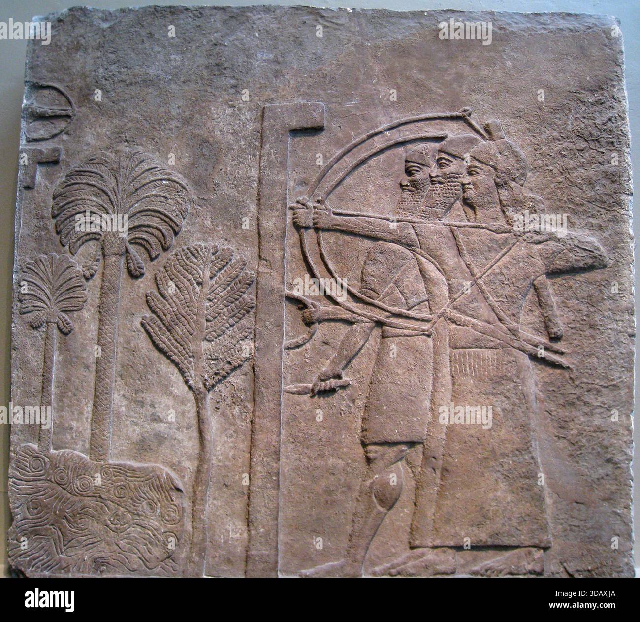Relief depicting Assyrian archers attacking a besieged city, most ...