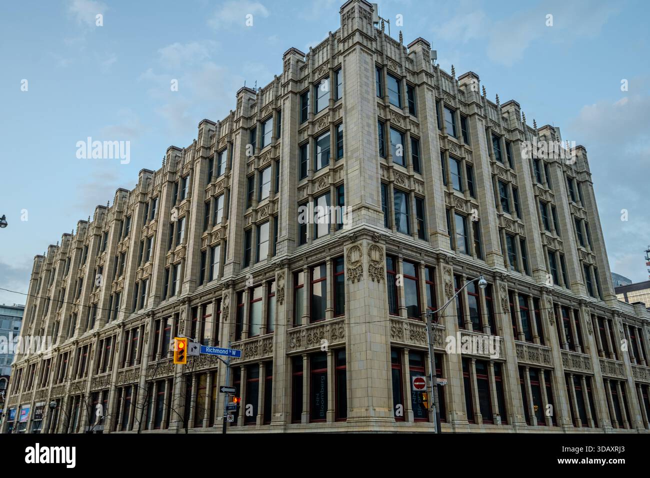 Ornate Beaux Arts style office building stands on a busy intersection ...