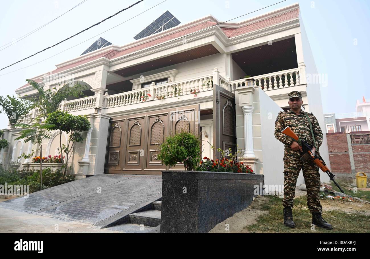 LUCKNOW, INDIA - DECEMBER 12: CRPF personnel stand guard as ED raid continues at the residence ...