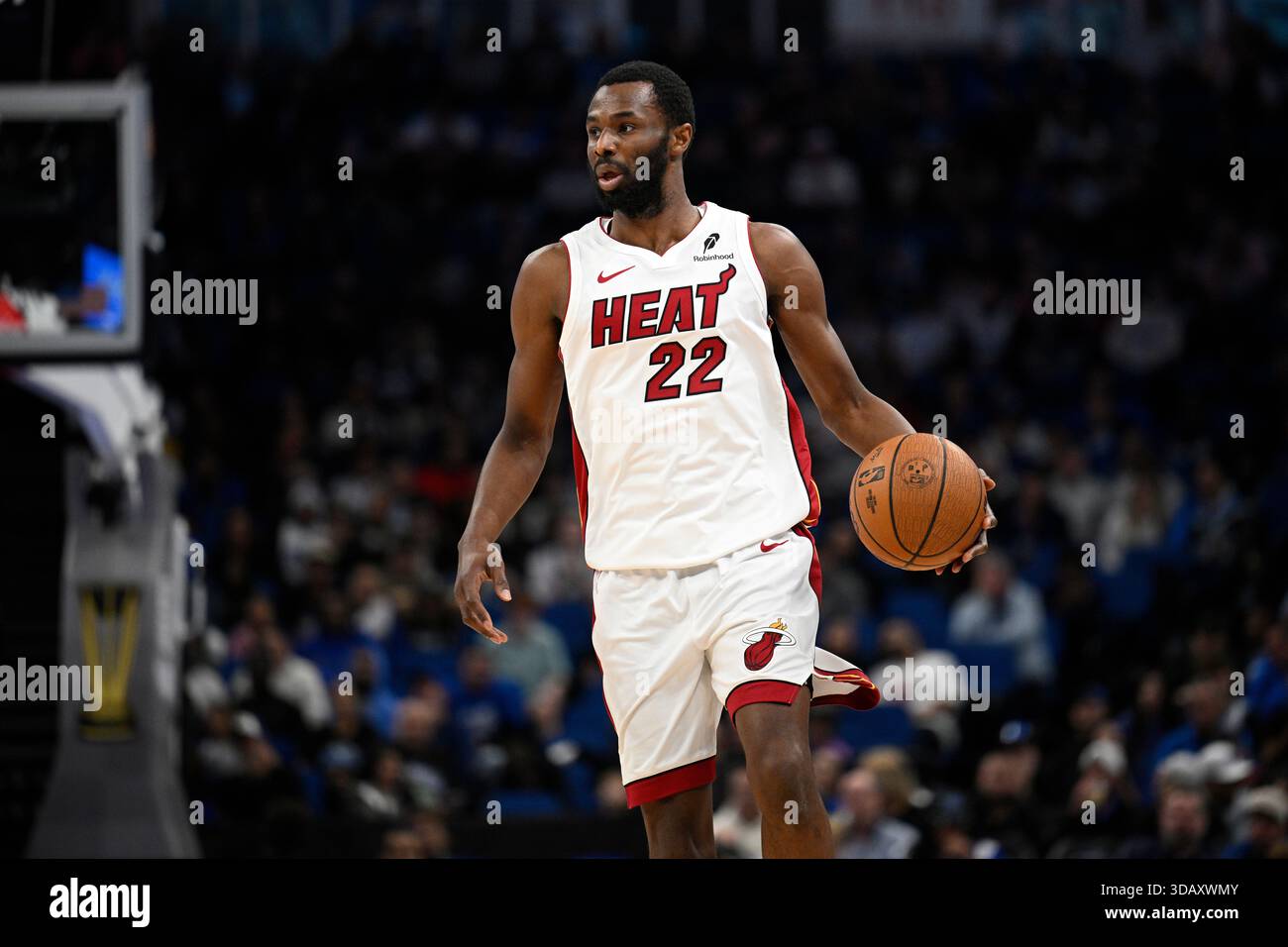 Miami Heat forward Andrew Wiggins (22) brings the ball up the court ...
