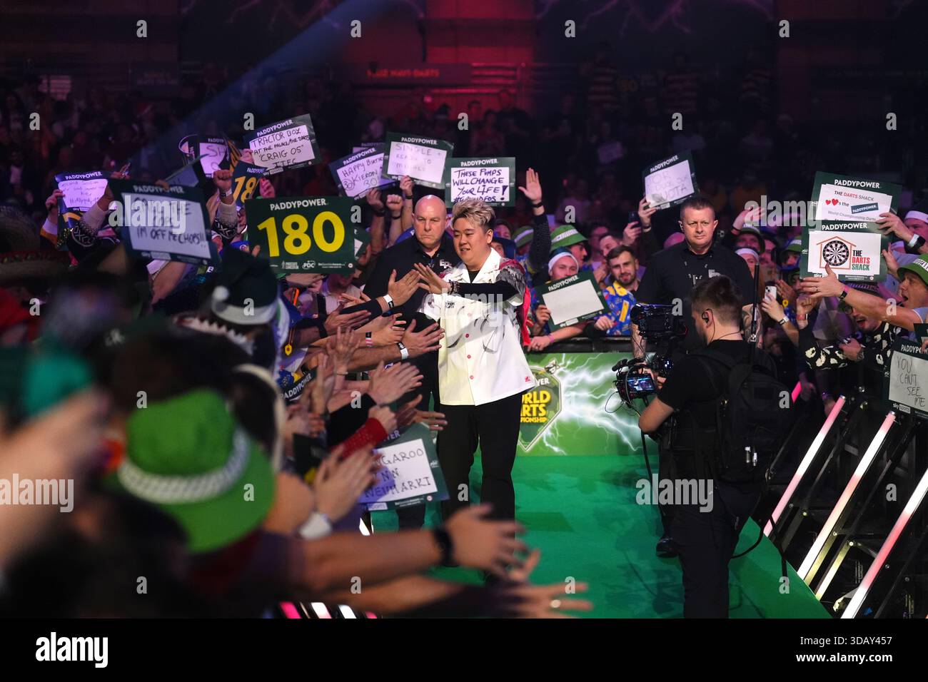 Man Lok Leung walks to the oche on day two of the Paddy Power World Darts Championship at the ...