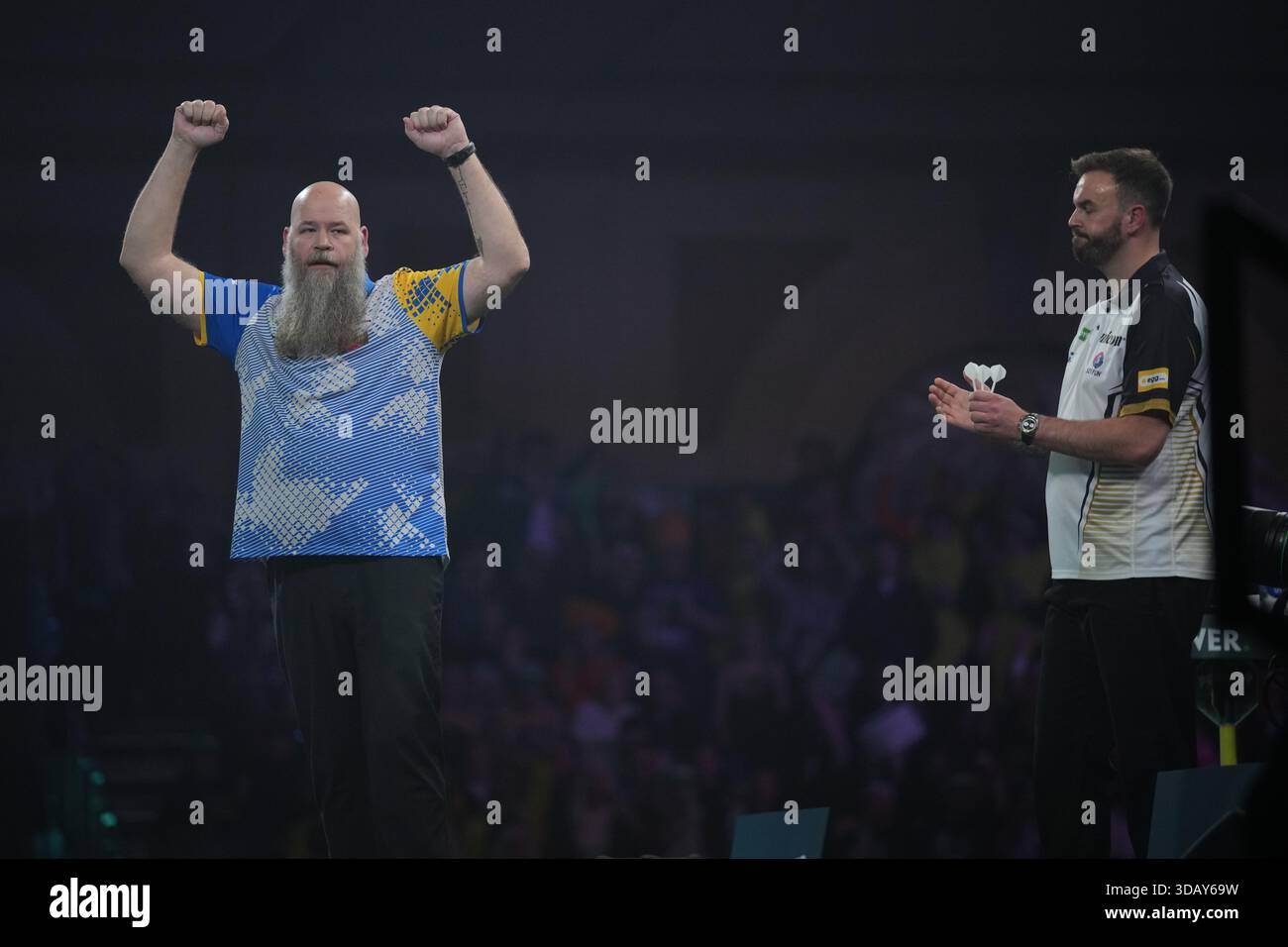 Andreas Harrysson of Sweden, left, celebrates after winning a round one ...