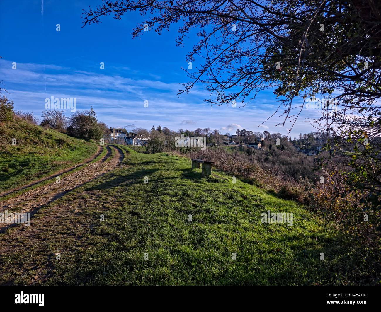 Wooden Bench at End of Rural Path Overlooking Village in Cotswolds ...