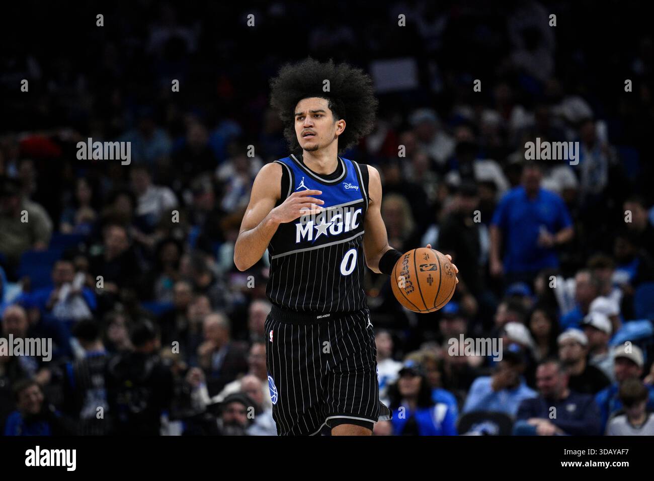 Orlando Magic guard Anthony Black (0) brings the ball up the court ...