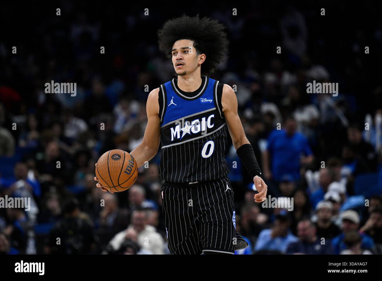 Orlando Magic guard Anthony Black (0) brings the ball up the court ...