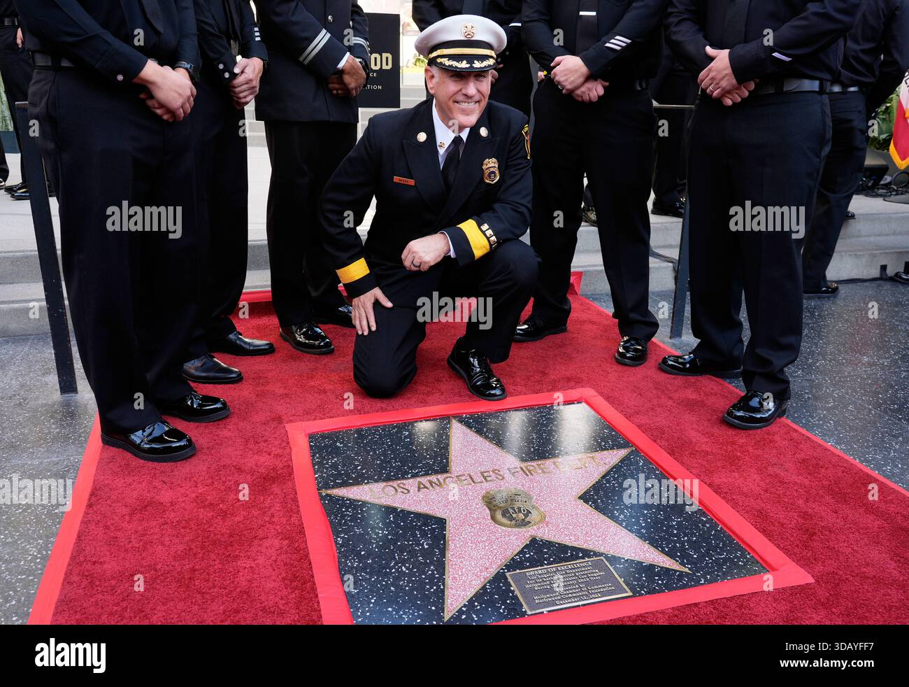 Los Angeles Fire Department Chief Jamie Moore poses with firefighters ...