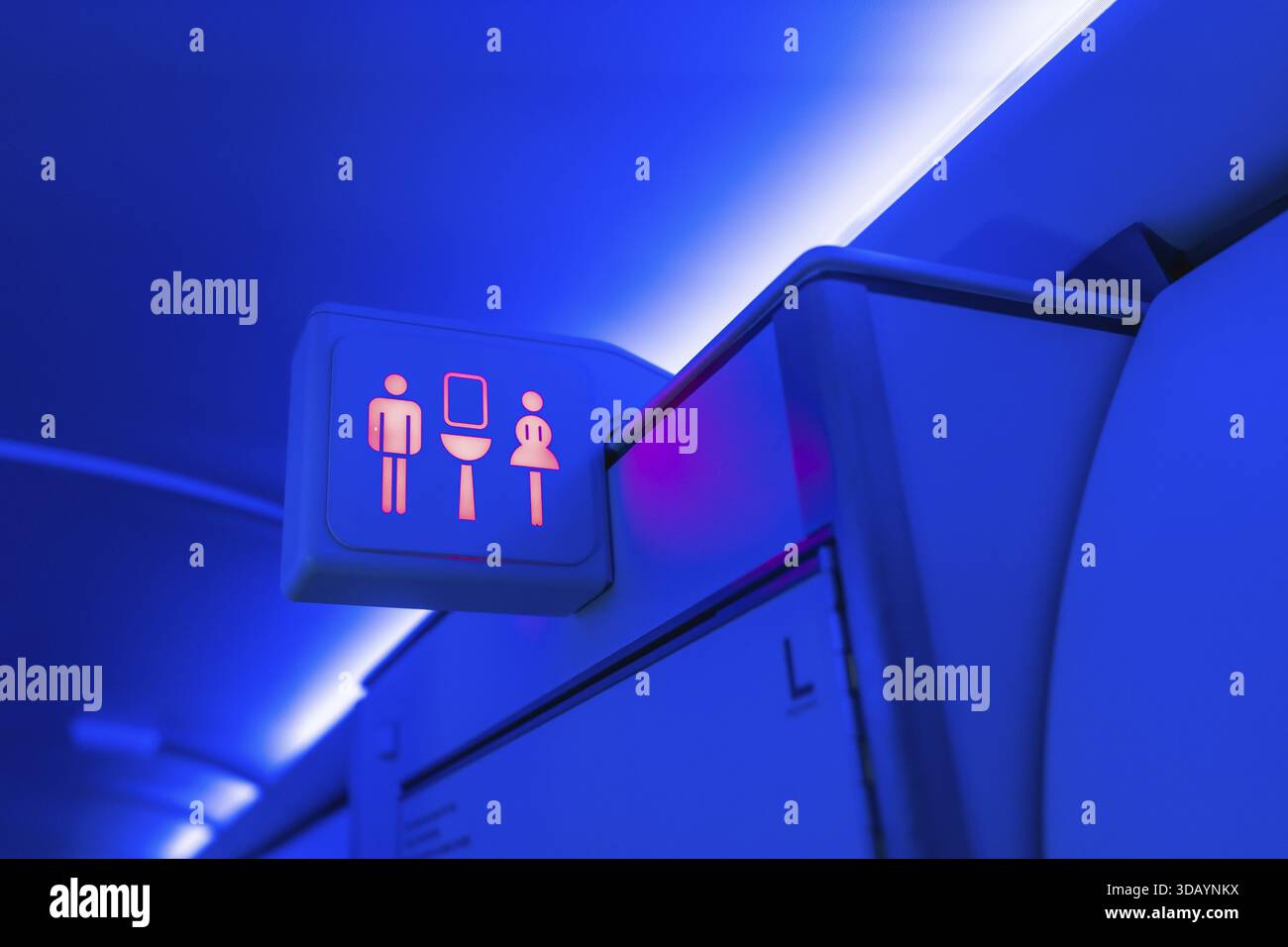 Illuminated restroom sign indicating availability with male and female ...
