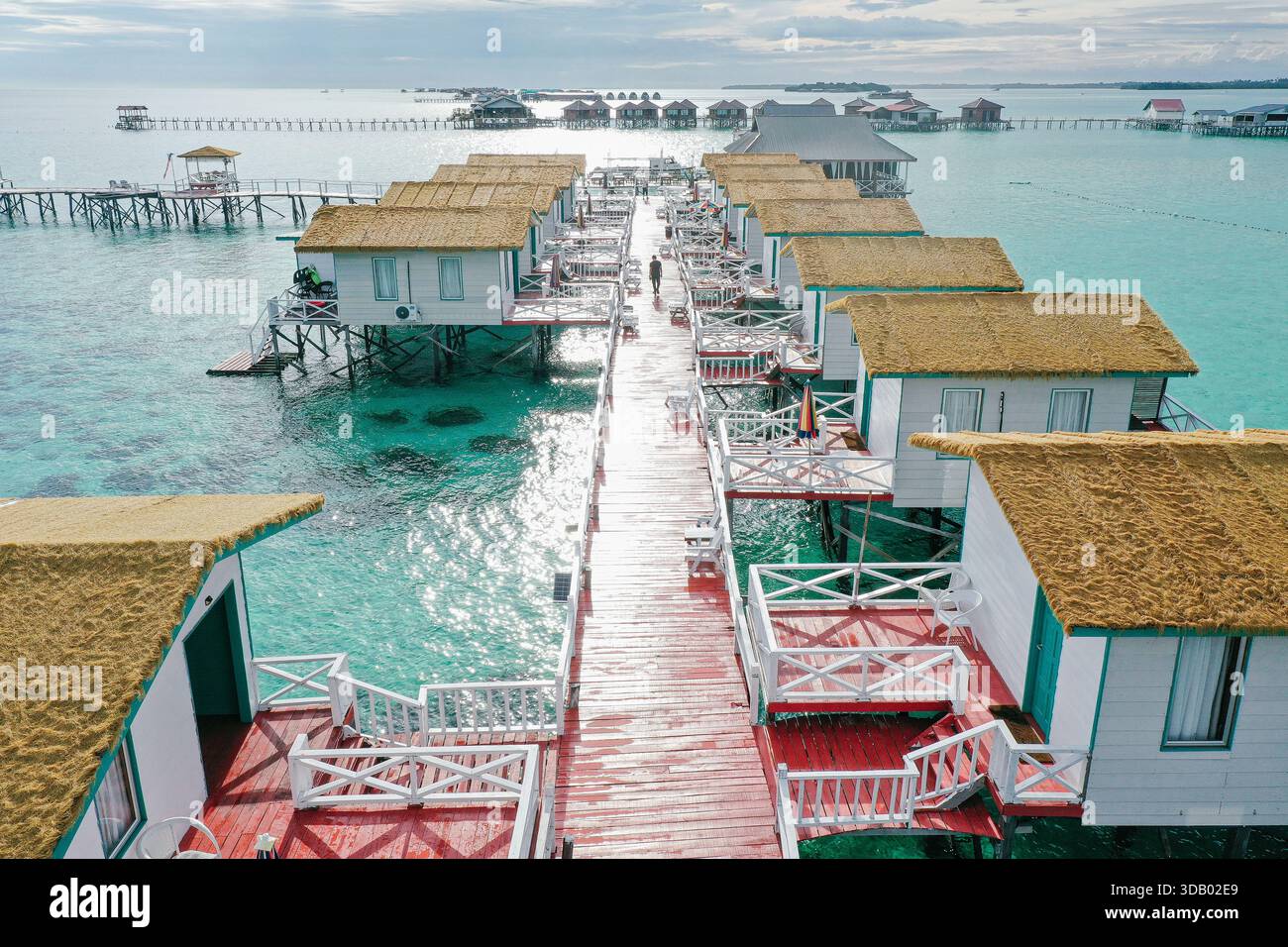 Aerial view of over water bungalows connected by wooden walkways above ...