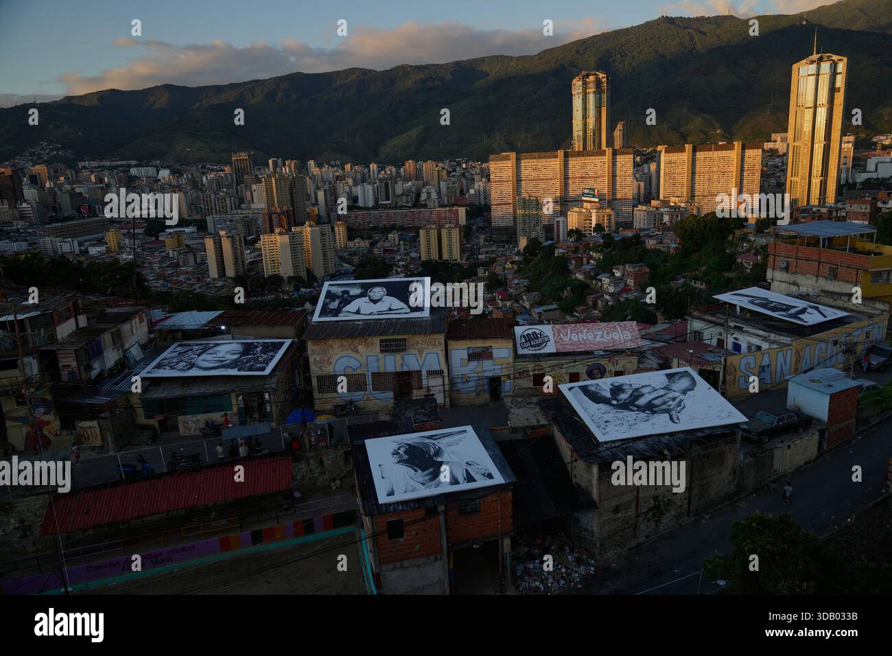 Pictures of residents are featured on building rooftops in the San ...