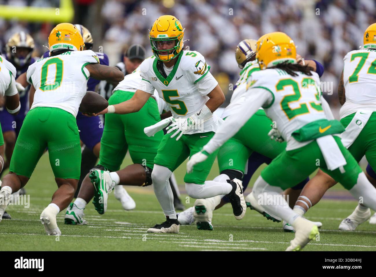 SEATTLE, WA - NOVEMBER 29: Oregon (QB) #5 Dante Moore prepares to hand ...