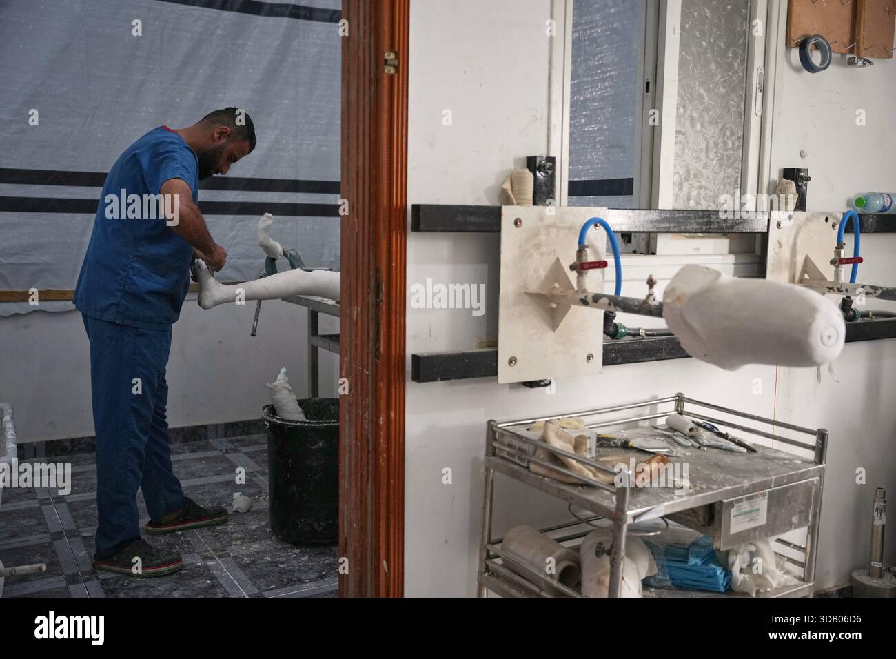 Prosthetic limb technician Ahmed Al-Ashqar, 34, prepares a leg ...