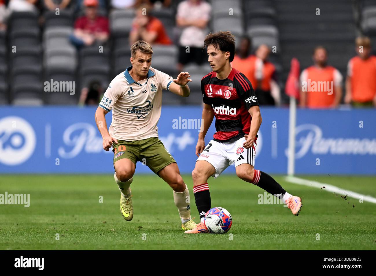 Georgios Vrakas of the Roar and Aidan Simmons of the Wanderers compete for possession during the ...