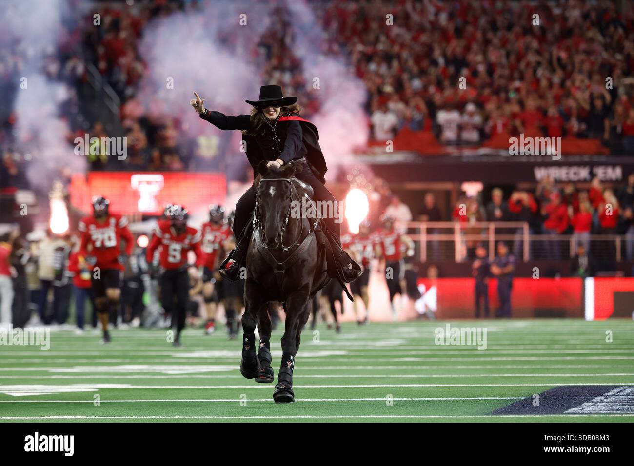 Texas Tech University mascot, the masked rider, takes the field with ...