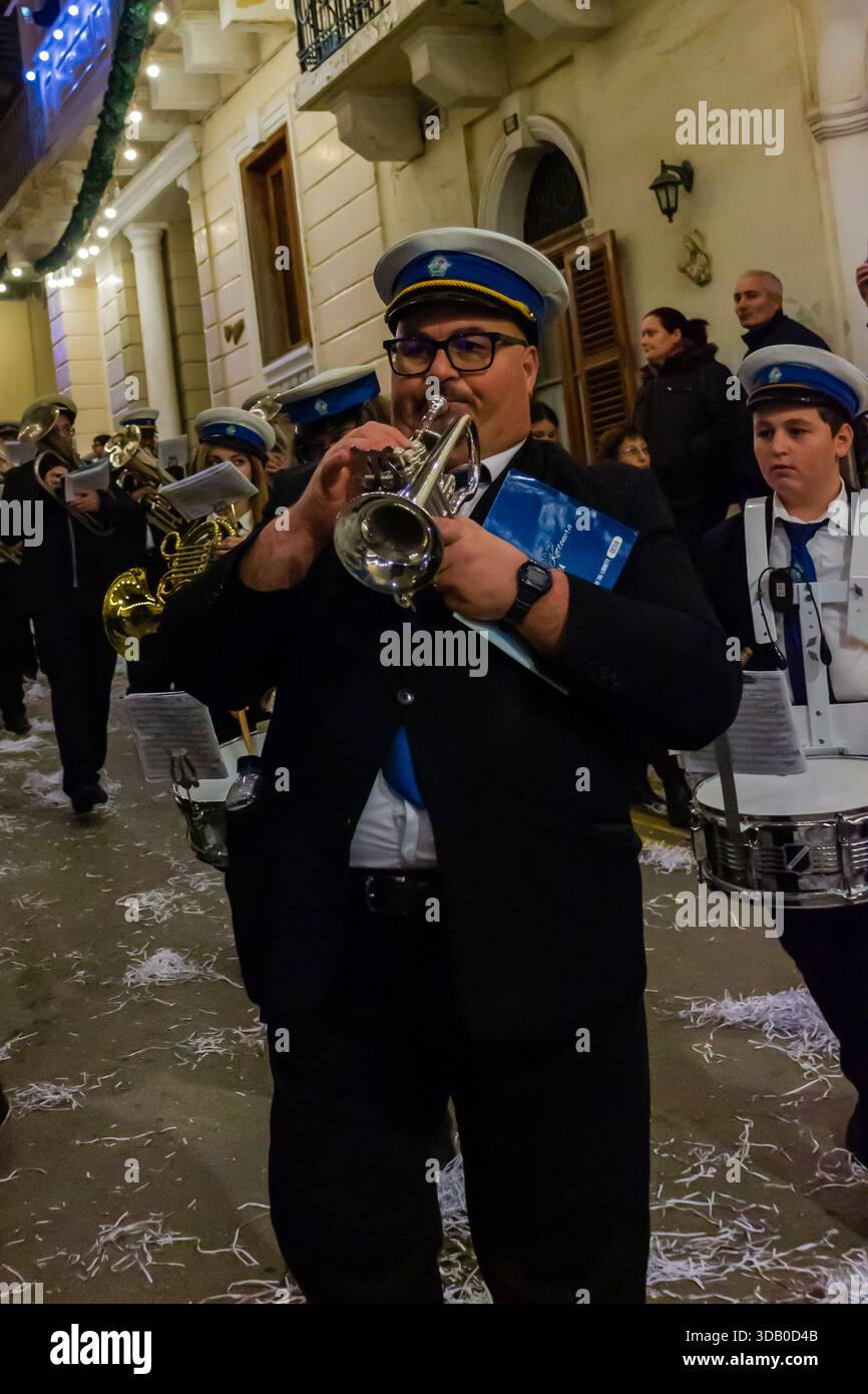 Brass Band Parade On City Street At Night With Festive Lights Stock ...