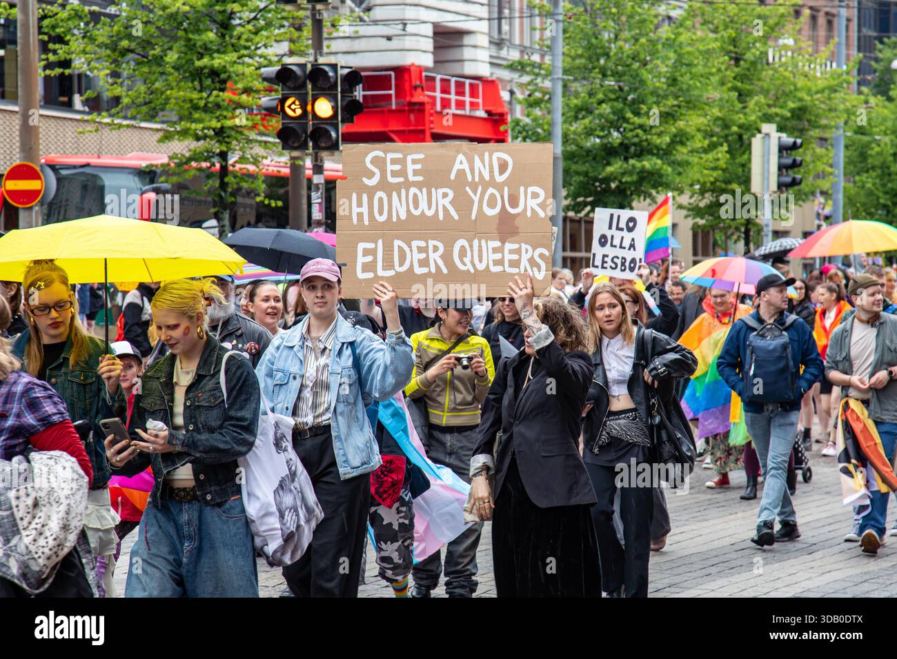 See and honour your elder queers. Handwritten cardboard sign at ...