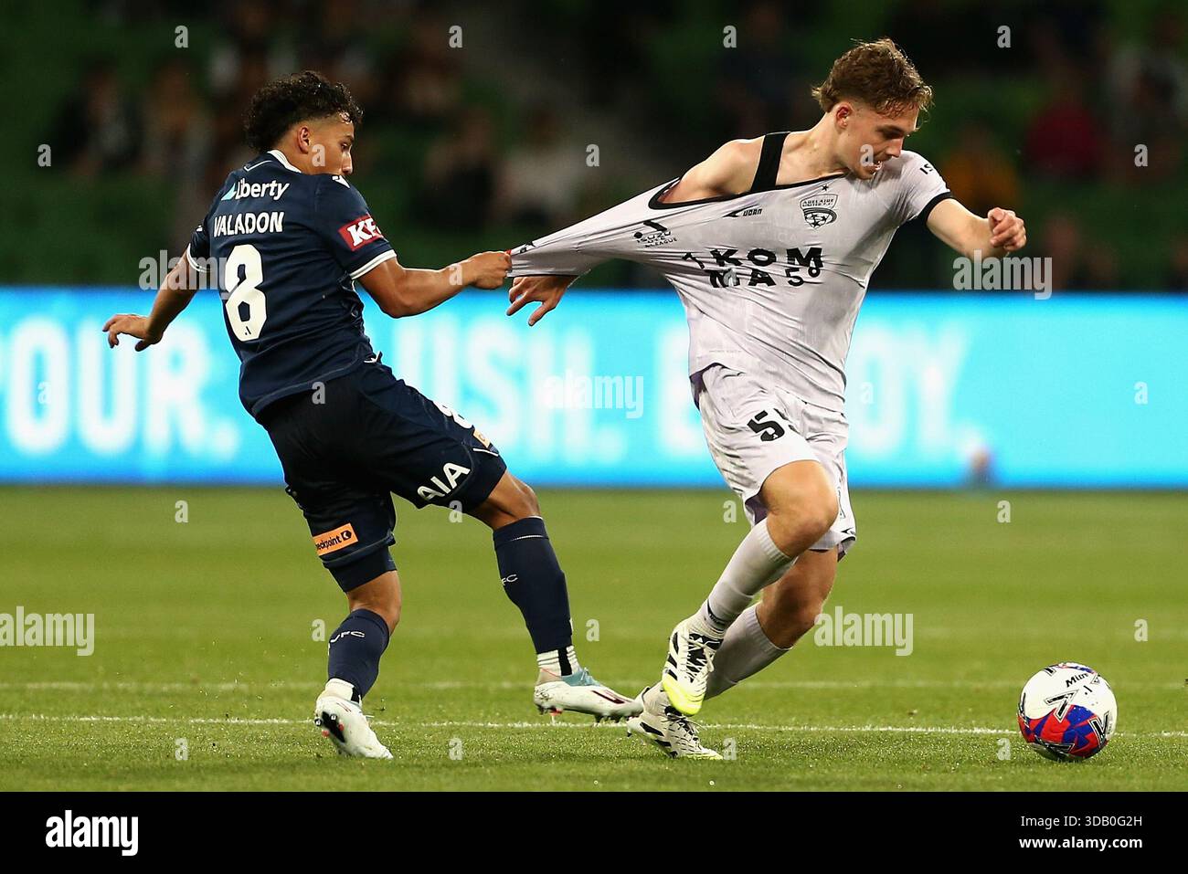 Jordi Valadon of Victory and Ethan Alagich of United contest the ball ...