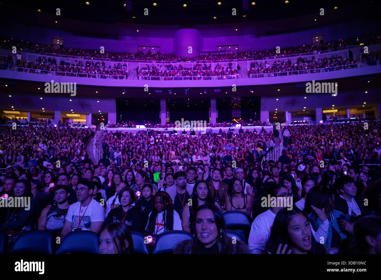 Concertgoers wait to watch the group KATSEYE perform on Friday, Dec. 12 ...