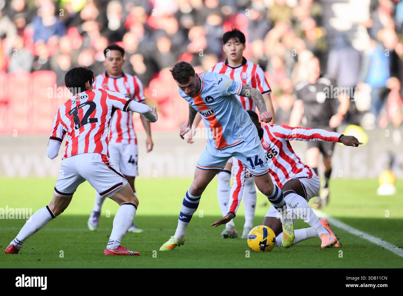 Josh Tymon of Swansea surrounds by Stoke players during the Sky Bet ...