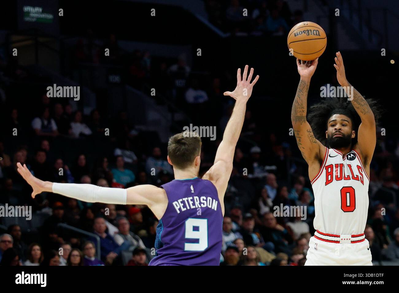 Chicago Bulls guard Coby White (0) shoots over Charlotte Hornets ...