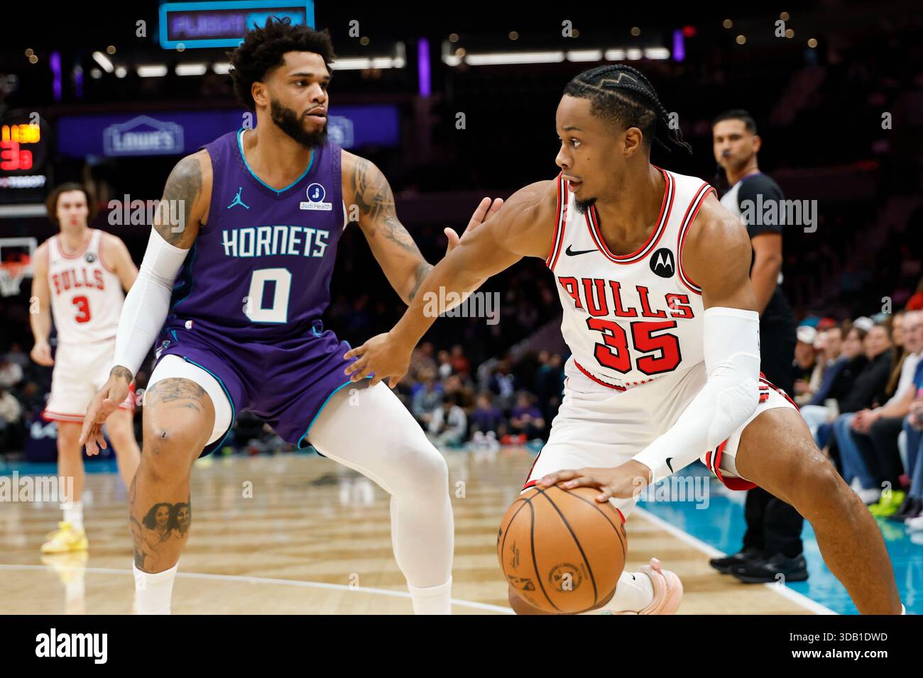 Chicago Bulls forward Isaac Okoro (35) drives against Charlotte Hornets ...