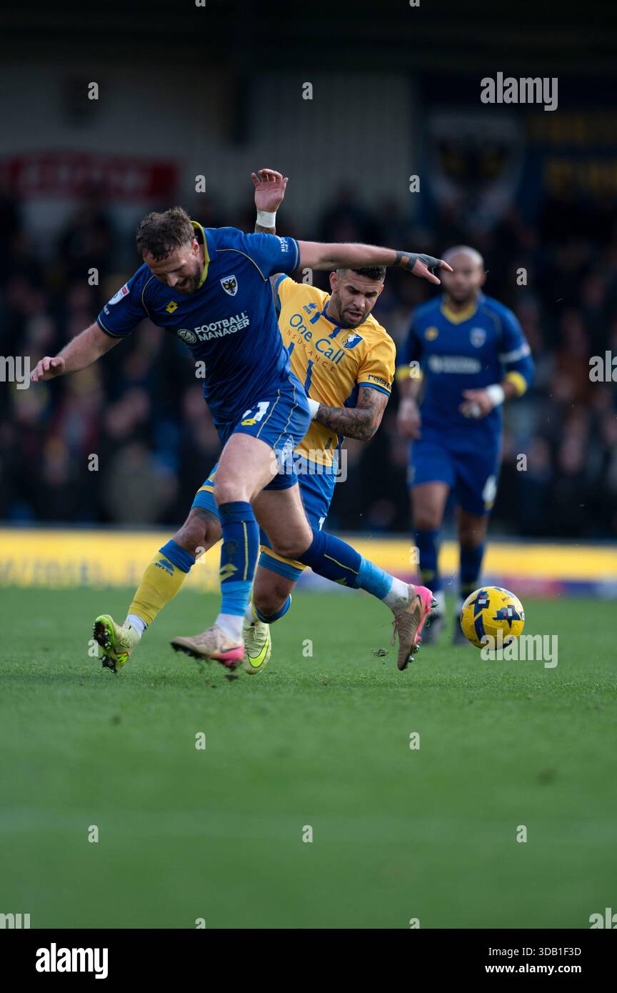London, England. 13th Dec 2025. Mansfield Town's Dom Dwyer (right) and ...
