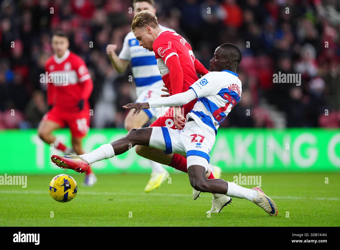 Middlesbrough's Tommy Conway and Queens Park Rangers' Amadou Mbengue ...