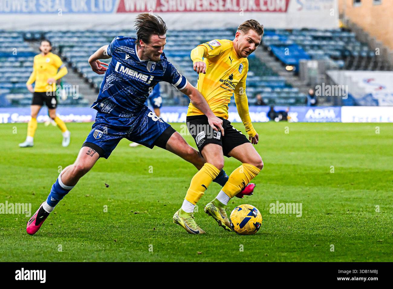 Ben Whitfield of Barrow AFC challenged by Armani Little of Gillingham ...