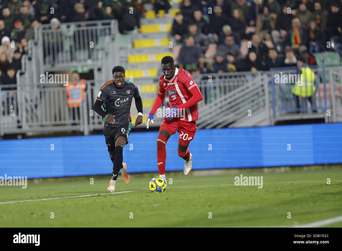Monza's DEMBA THIAM in action against Venezia's ISSA DOUMBIA during the ...