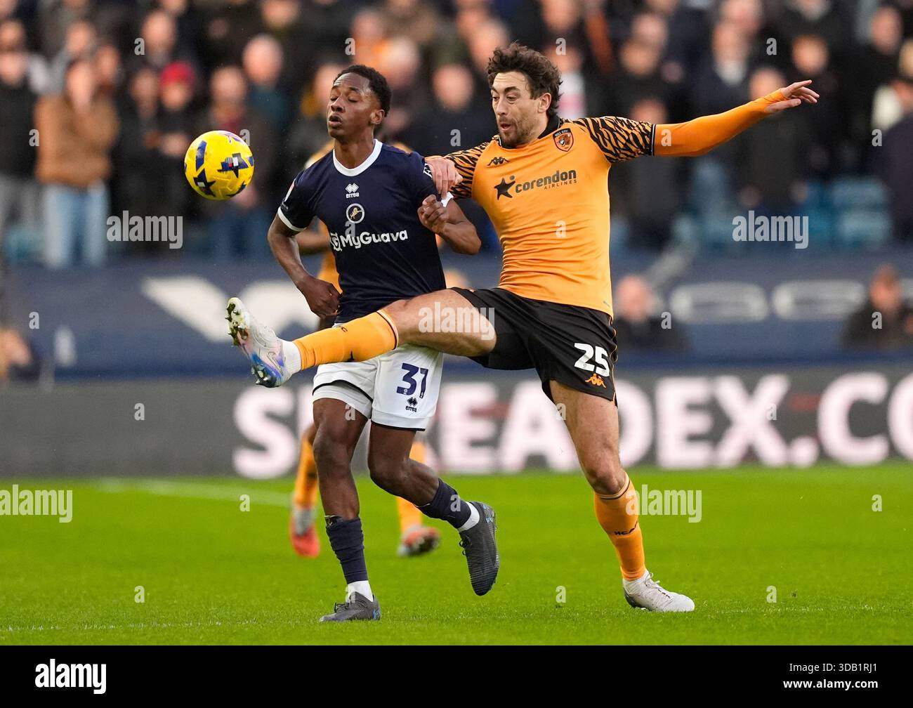 Millwall's Ra'ees Bangura-Williams (left) and Hull City's Matt Crooks ...