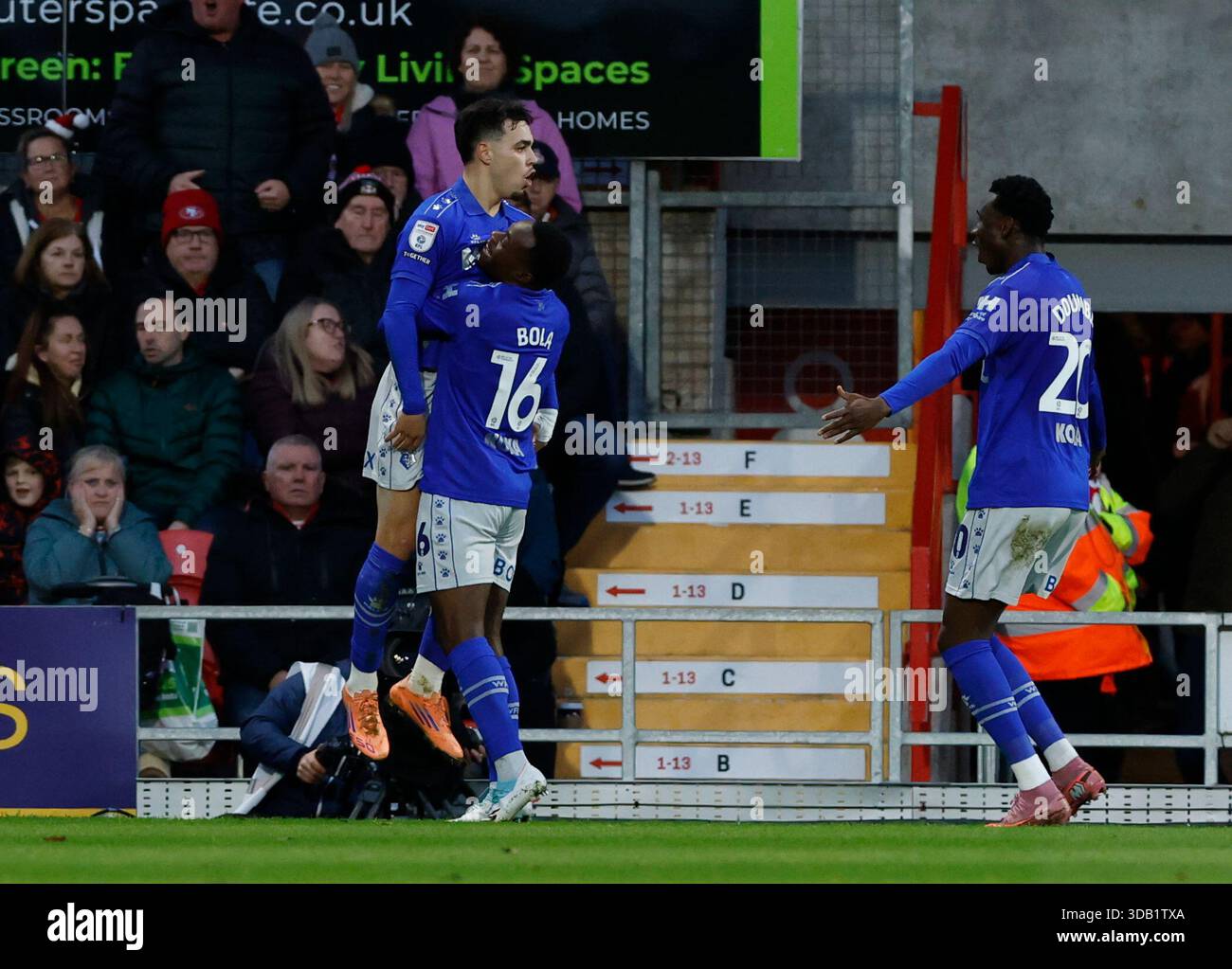 Watford's Othmane Maamma is lifted by team mate Marc Bola as they ...