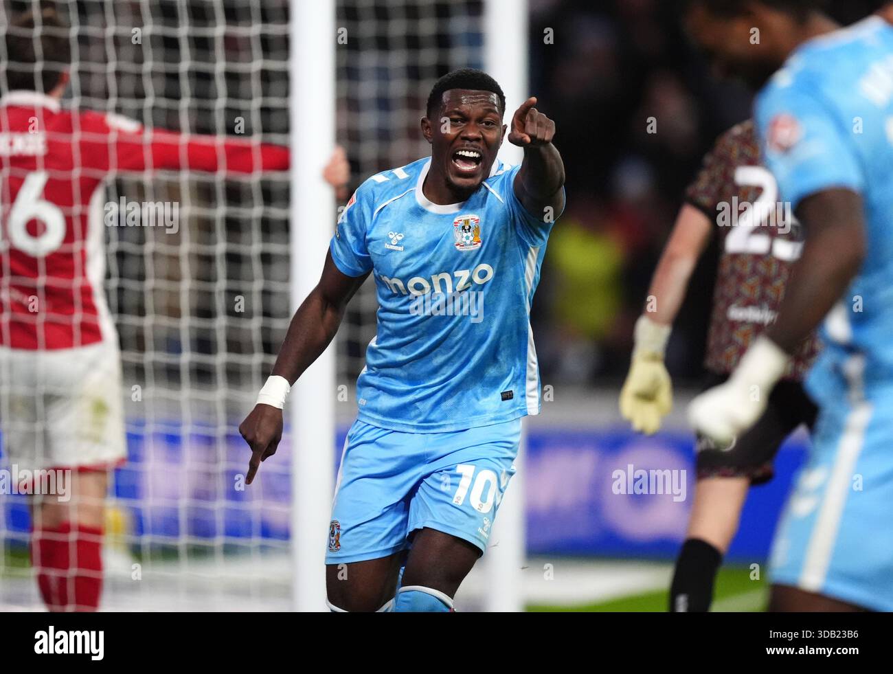 Coventry City's Ephron Mason-Clark (centre) celebrates scoring their ...