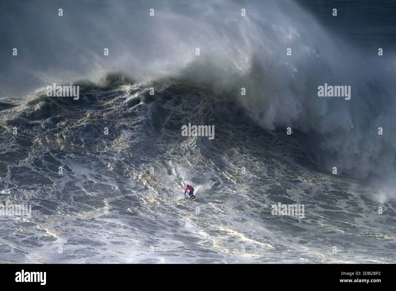 Surfer James Carew, from Australia, rides a wave during the Nazare Big ...