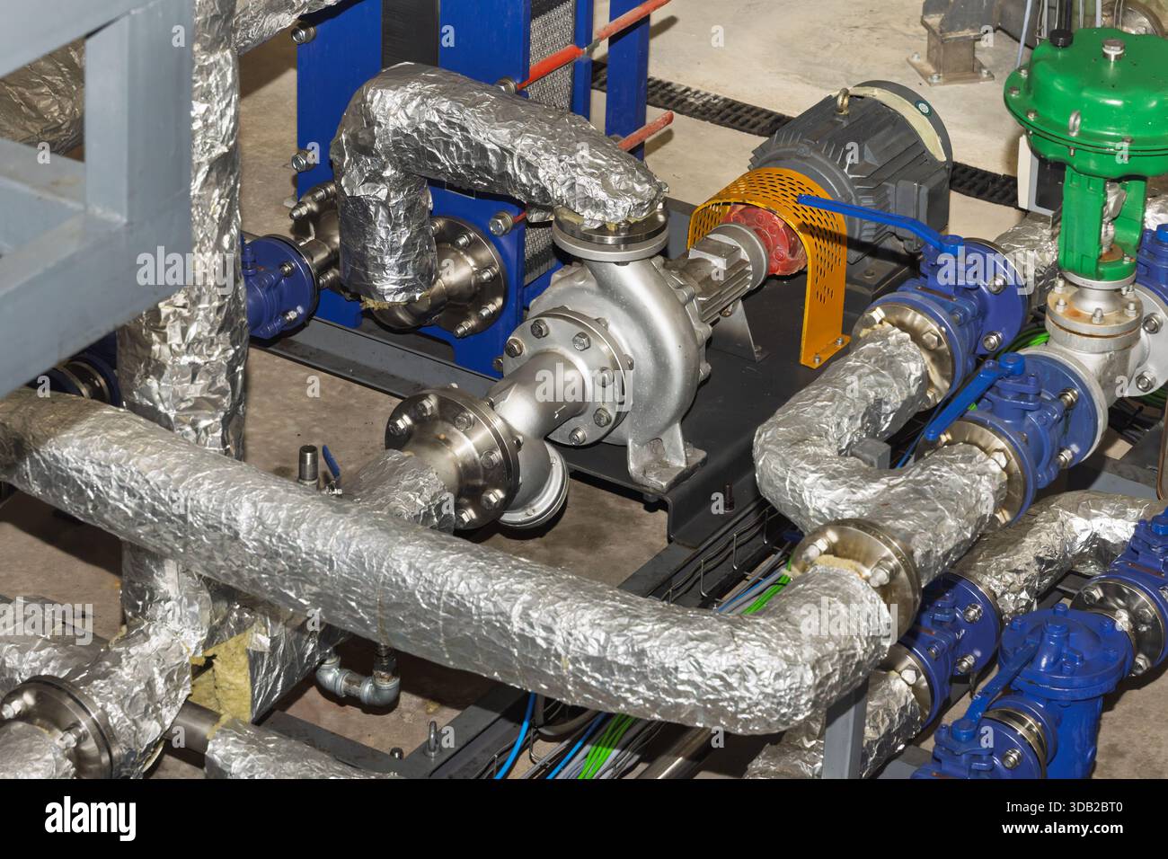 Heavy duty industrial pump and insulated stainless steel piping in an ...