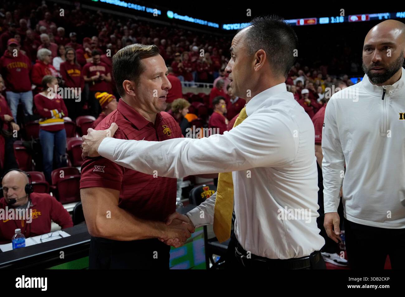Iowa State head coach T.J. Otzelberger, left, greets Iowa head coach ...