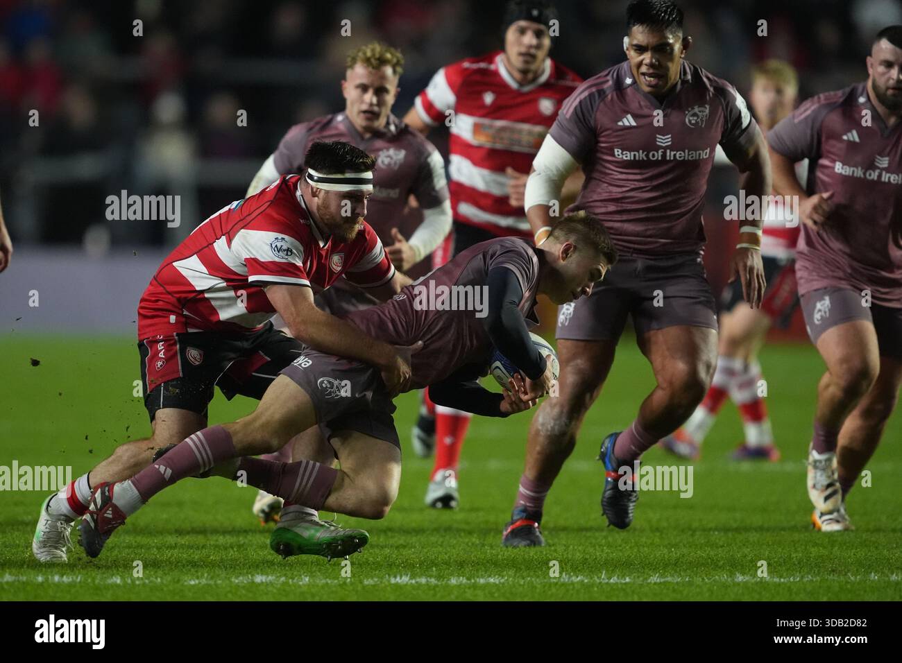 Munster Rugby's Jack Crowley is tackled by Gloucester Rugby's Dian ...