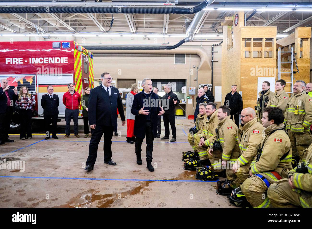 Prime Minister Mark Carney speaks with firefighters from the Ottawa ...
