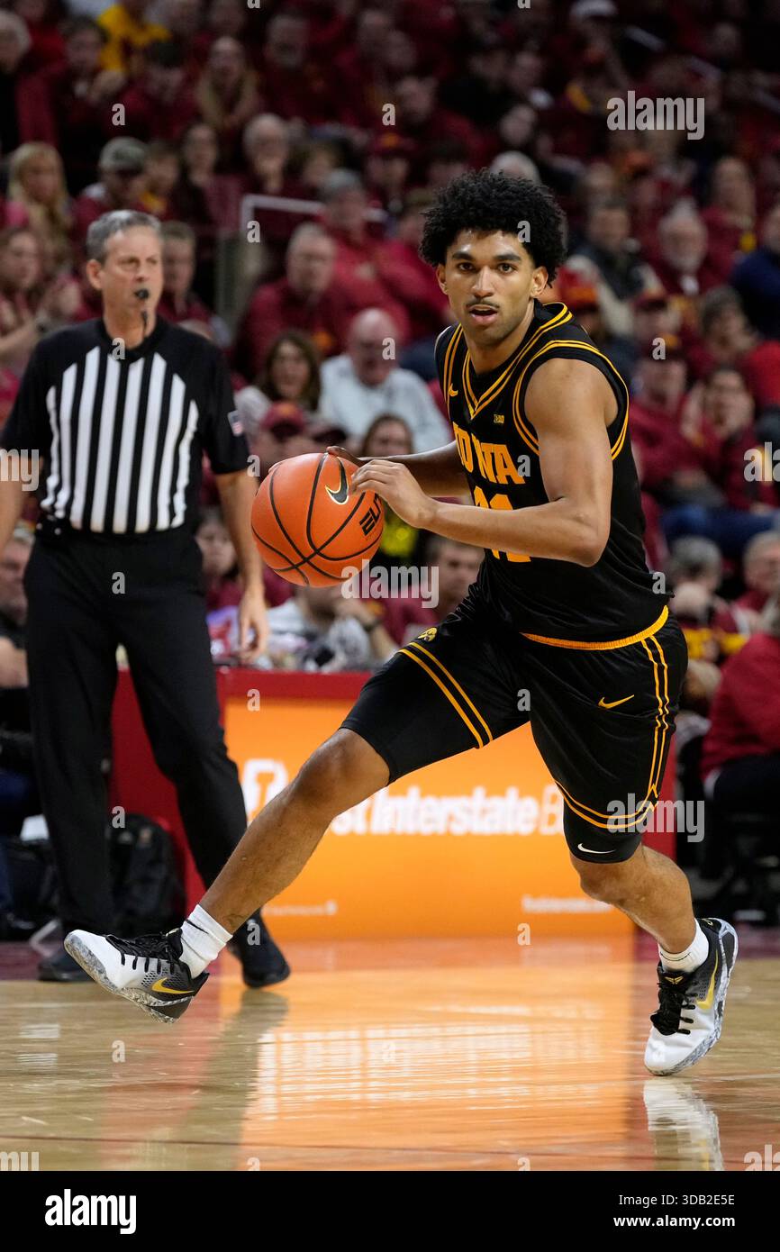 Iowa guard Kael Combs drives up court during the first half of an NCAA ...