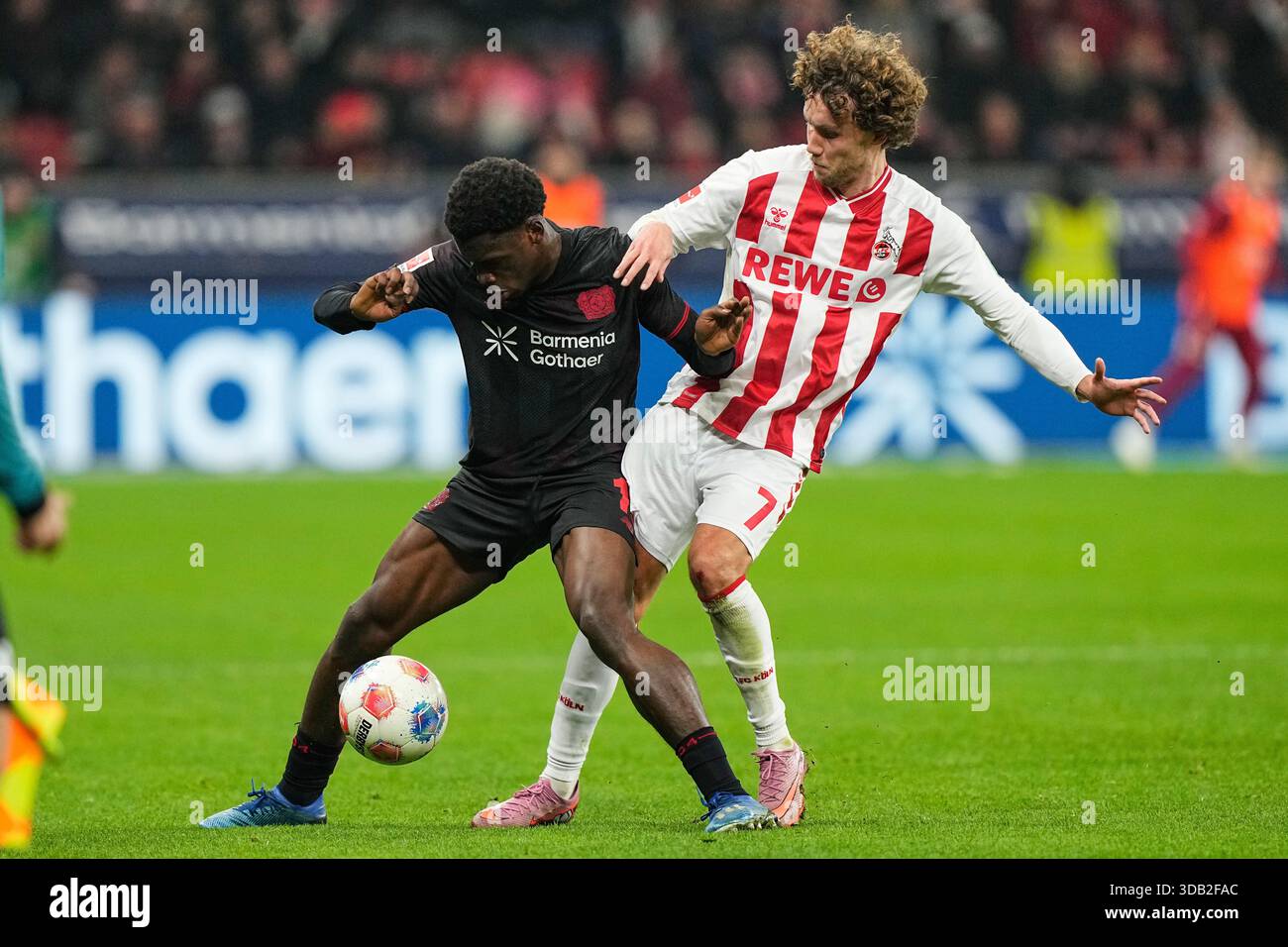 Cologne's Luca Waldschmidt and Leverkusen's Ernest Poku challenge for ...