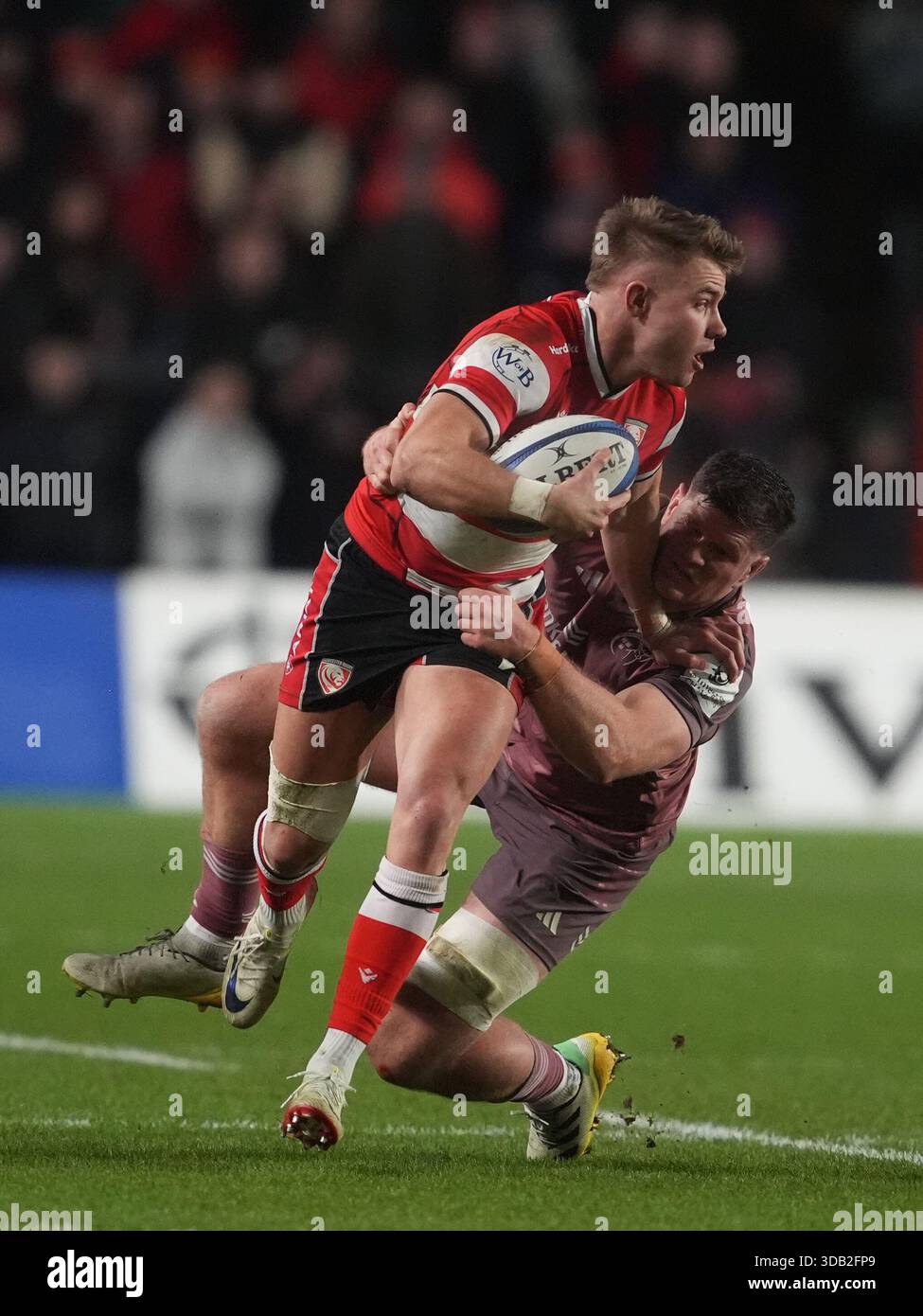 Gloucester Rugby's Charlie Atkinson is tackled by Munster Rugby's Jack ...