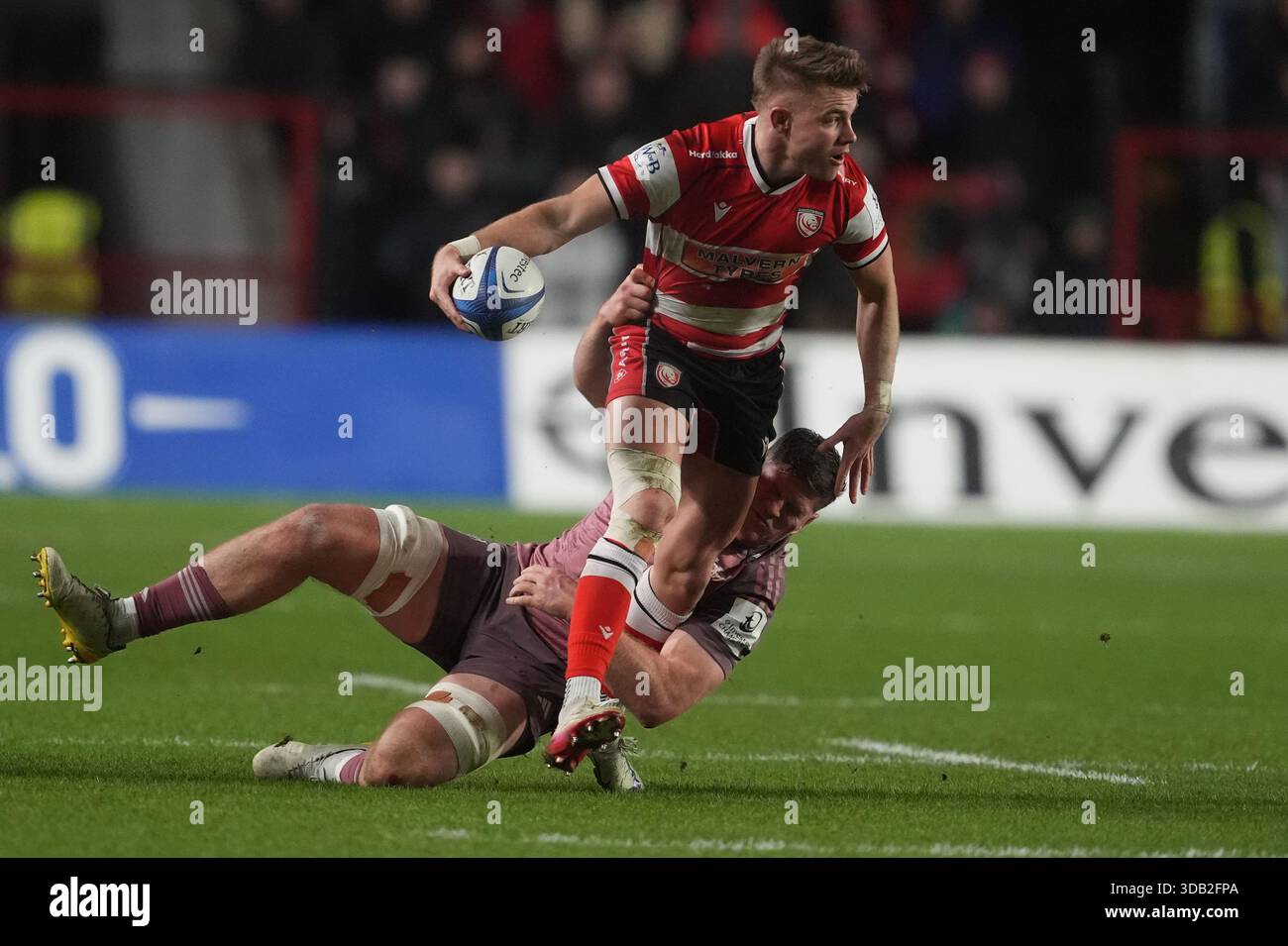 Gloucester Rugby's Charlie Atkinson is tackled by Munster Rugby's Jack ...